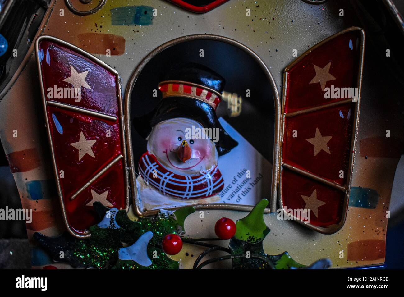cute snowman looking through a window Stock Photo - Alamy