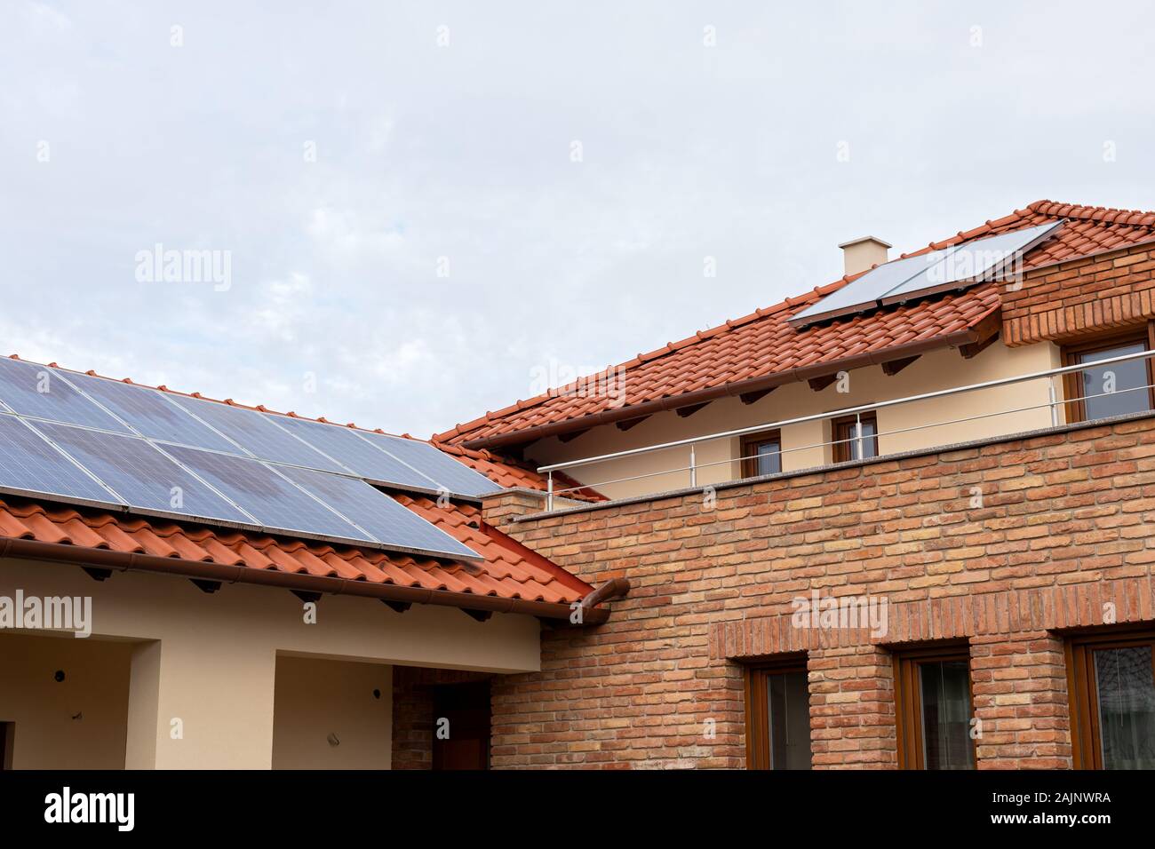 Modern house with solar panels on the roof Stock Photo - Alamy