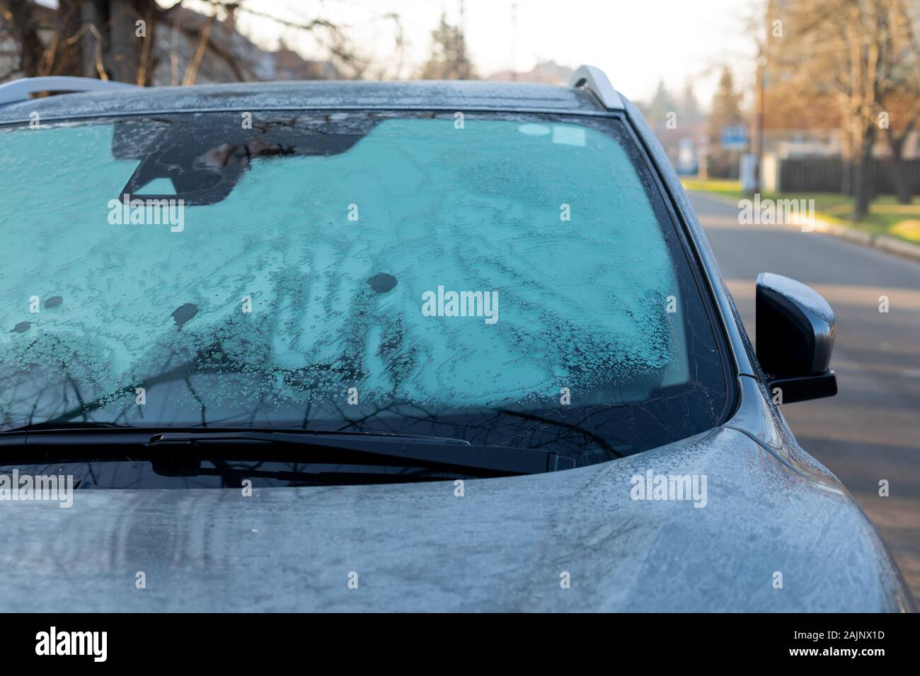 Frozen car parked on the street on December Stock Photo - Alamy