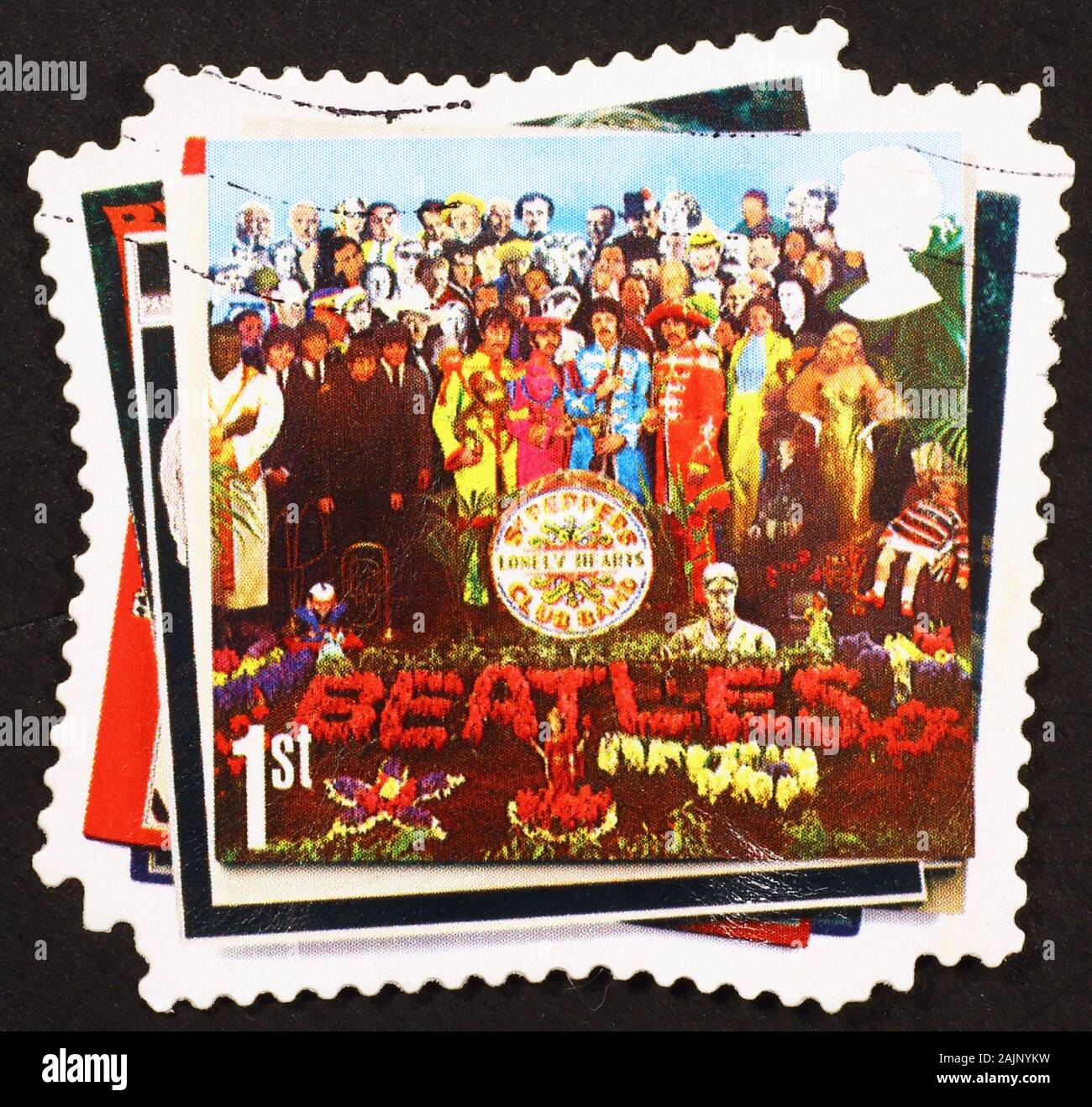 Famous LP cover of the Beatles on postage stamp Stock Photo - Alamy