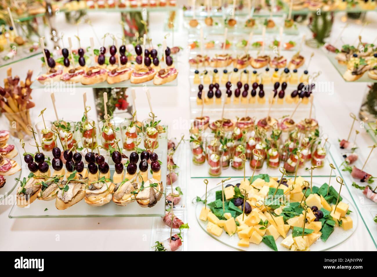 Catering. Off-site food. Buffet table with various canapes, sandwiches ...