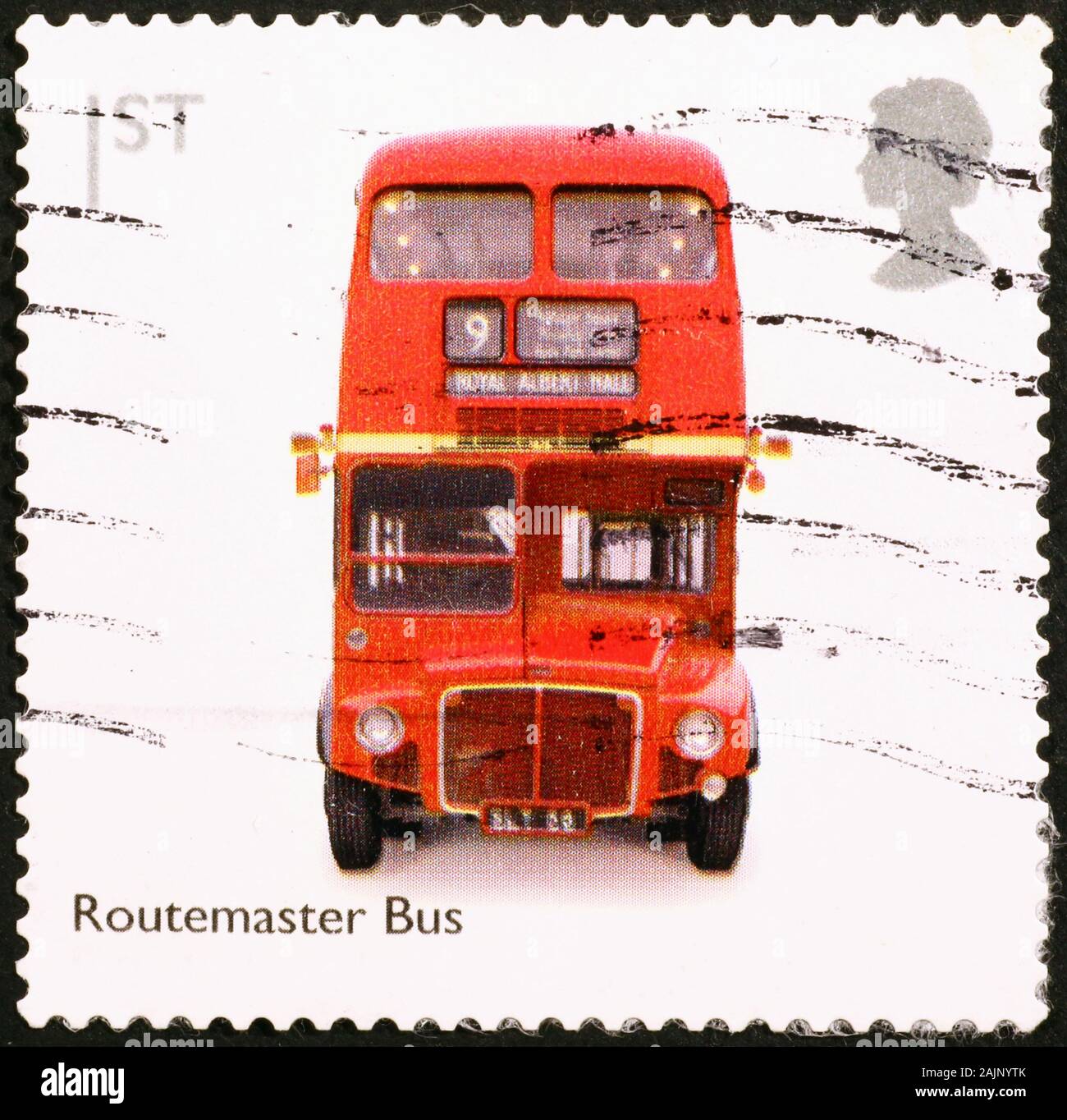 Red double-decker bus on english postage stamp Stock Photo - Alamy