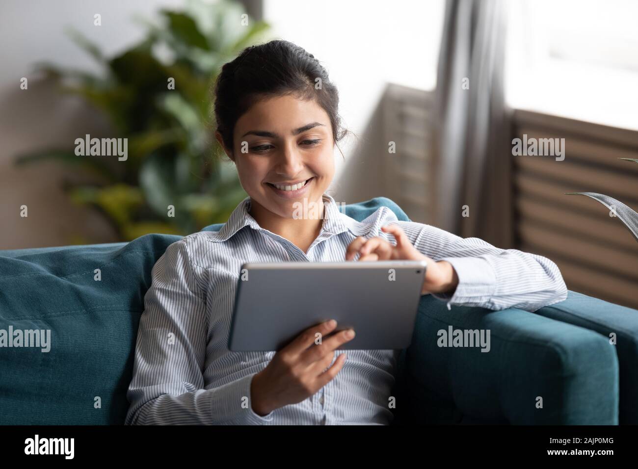 Indian girl using tablet hi-res stock photography and images - Alamy