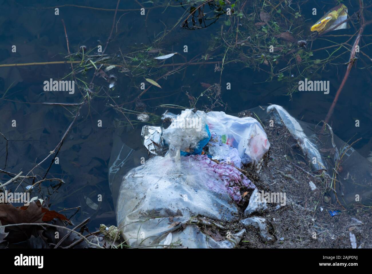 Plastic pollution in nature. Ecology contamination Stock Photo - Alamy