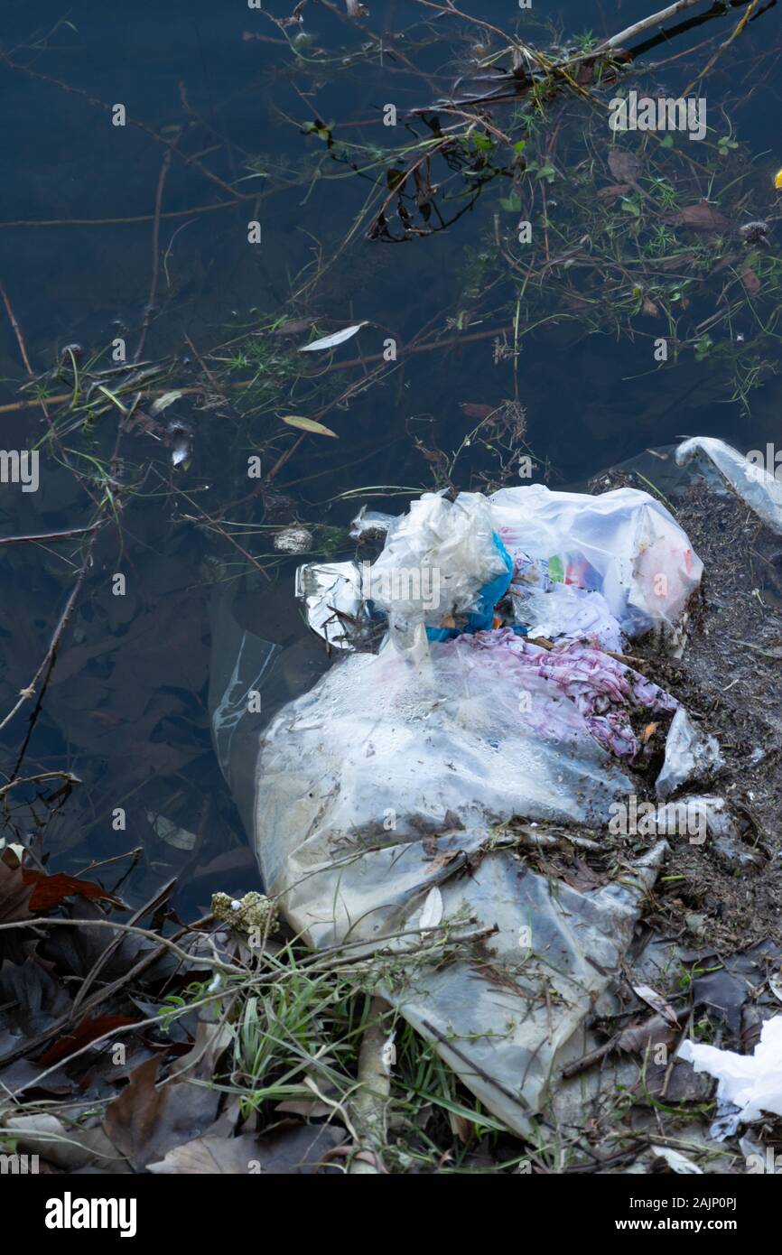 Plastic pollution in nature. Ecology contamination Stock Photo - Alamy