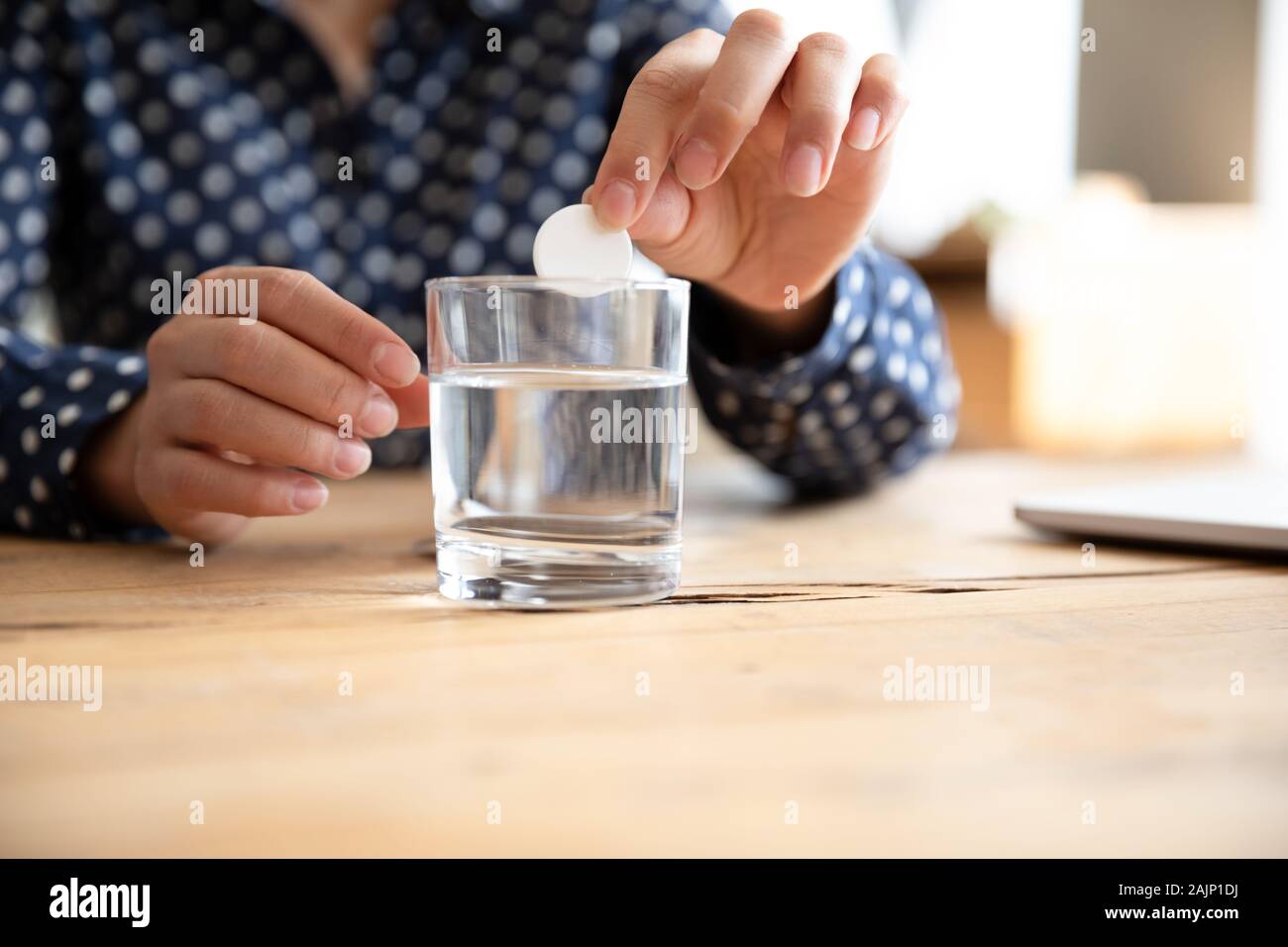 Hand drop dissolve tablet water hi-res stock photography and images - Alamy