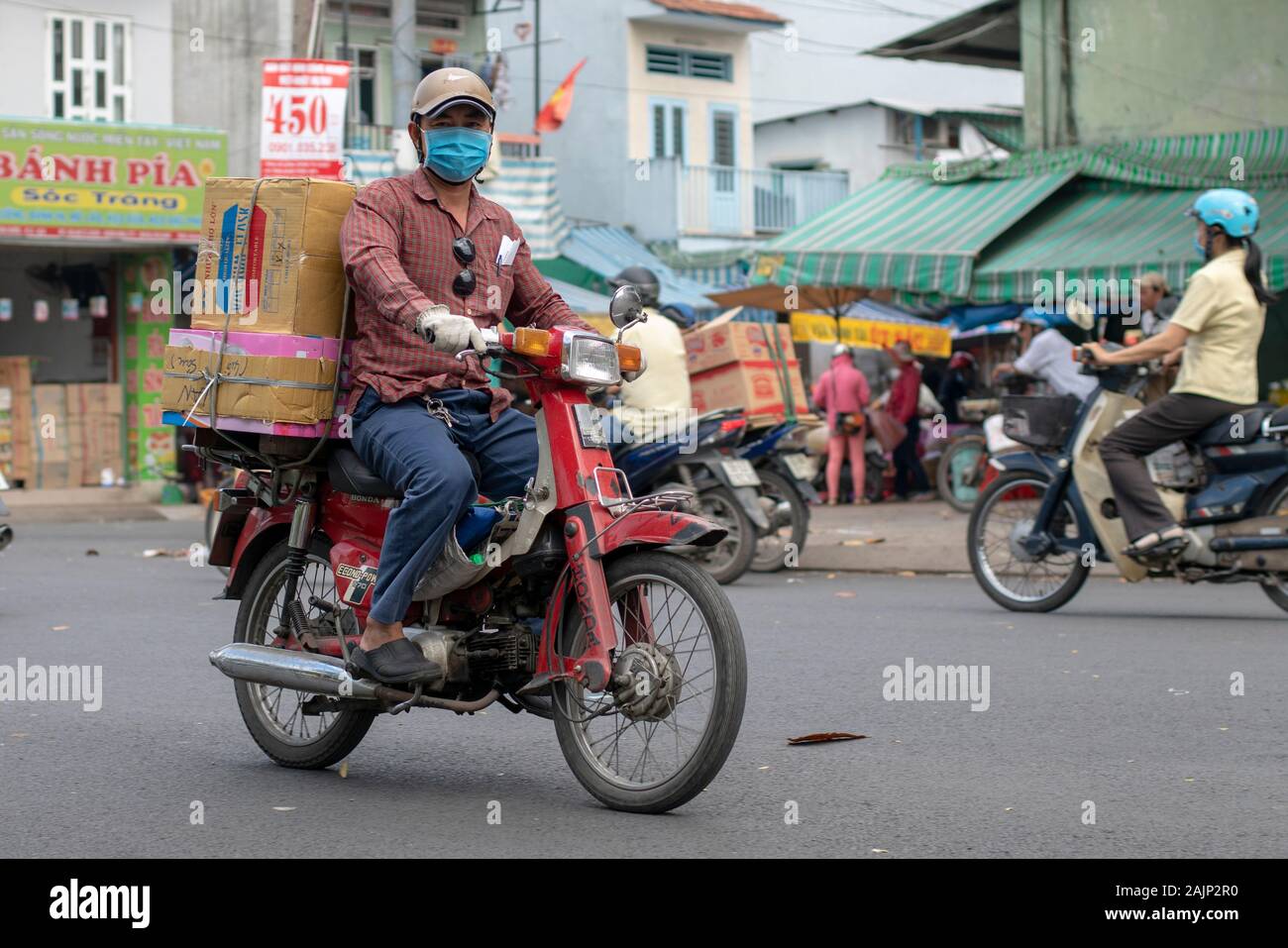 A two-wheel driver protects himself against pollution with a mask Stock ...