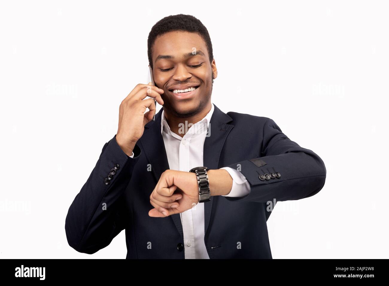 Punctuality Concept. Happy african manager checking time on wrist watch ...