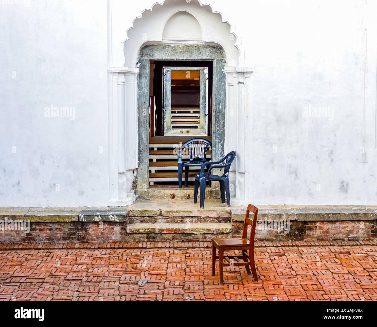 Interior courtyard of Kathmandu palace with white walls and arched ...