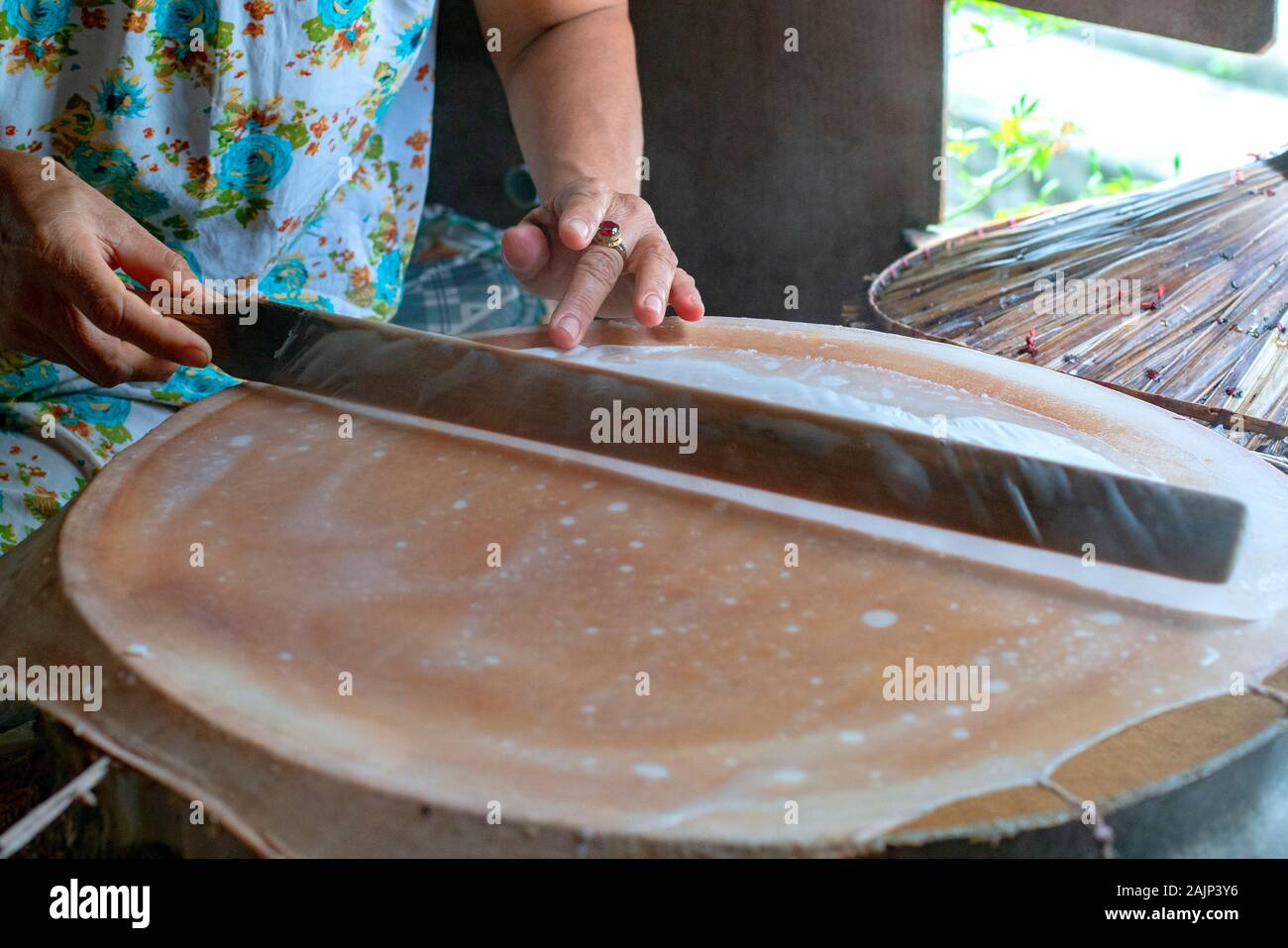 Artisanal production of a rice sheet Stock Photo - Alamy