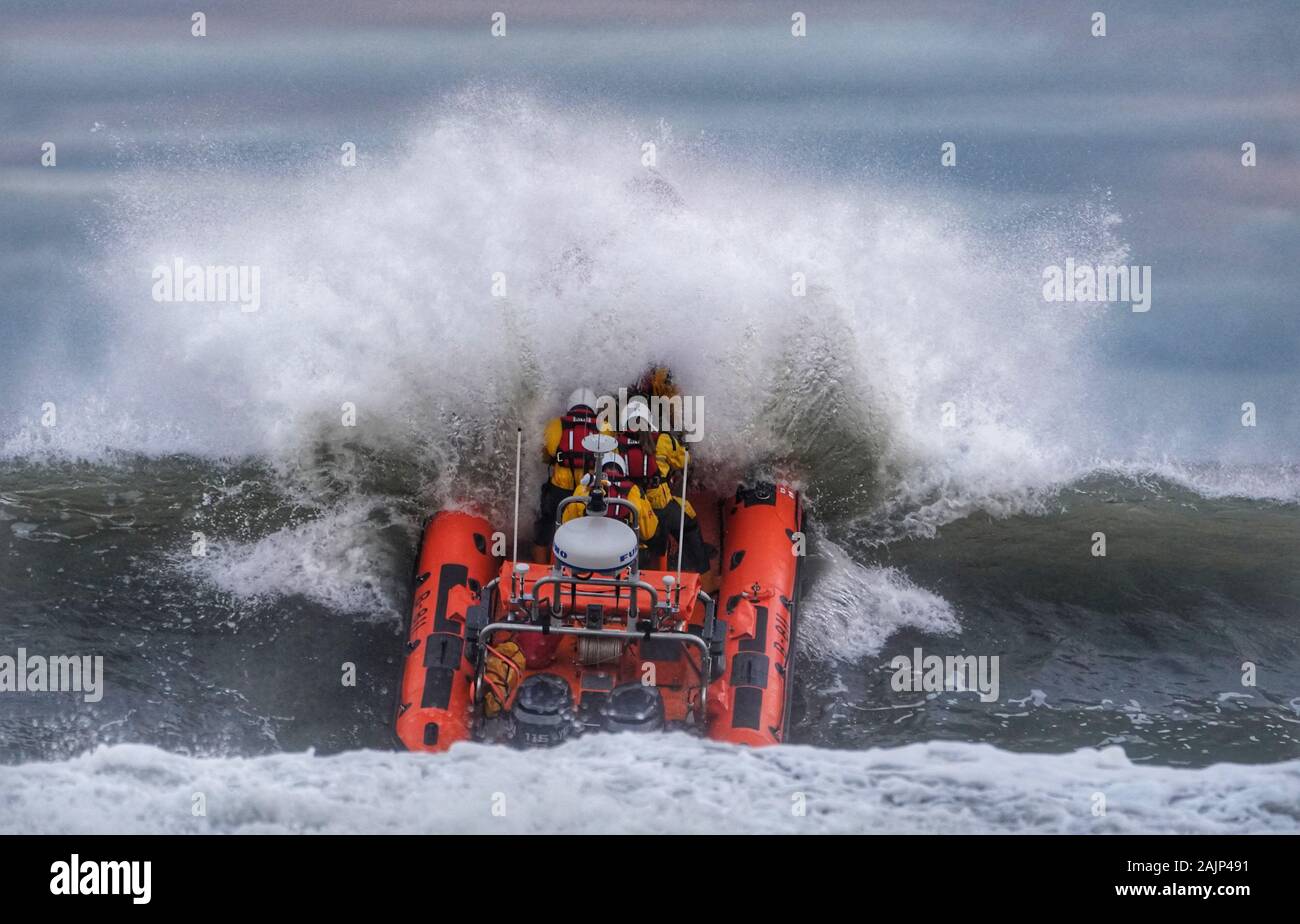 The RNLI Cullercoats B811 hits the crest of a wave as its crew patrols ...