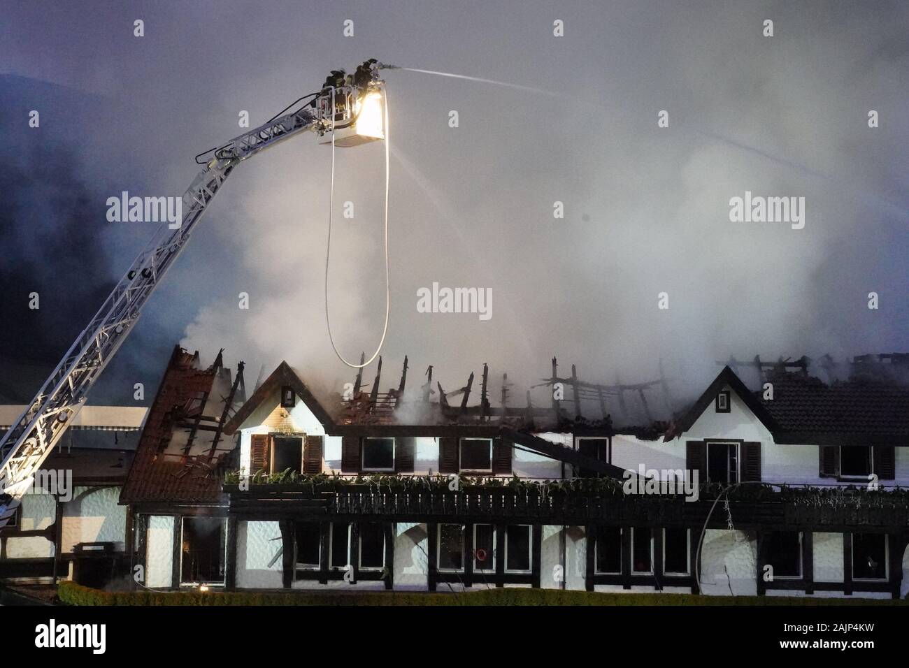 Baiersbronn, Germany. 05th Jan, 2020. Fire brigade personnel extinguish ...