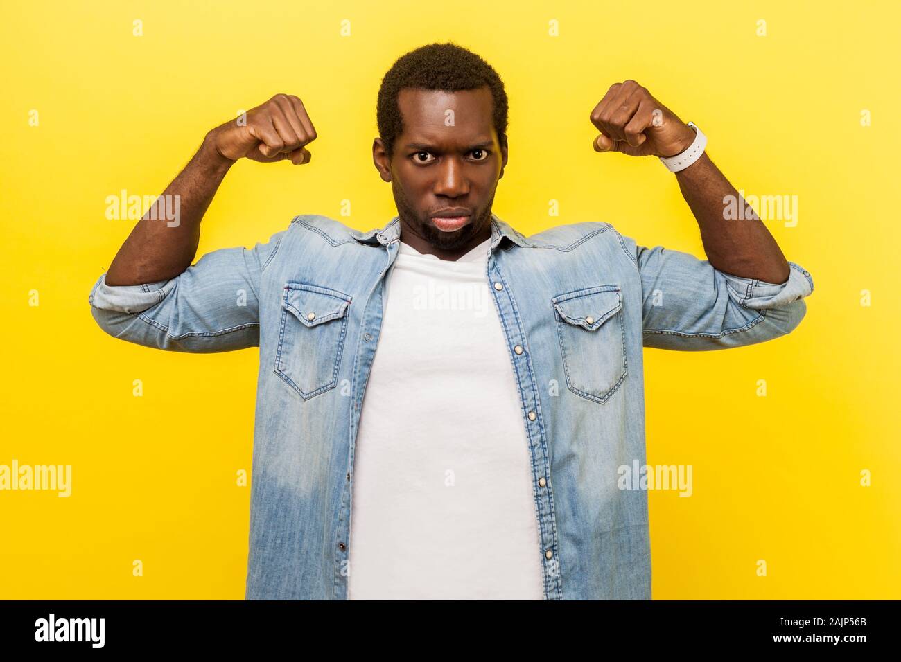 I'm strong! Portrait of self-confident motivated young man in denim ...