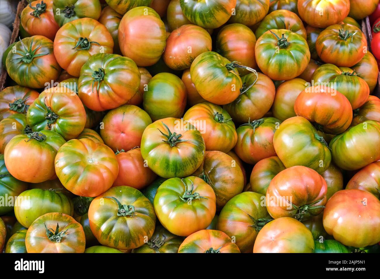 Beef tomatoes for sale at a market Stock Photo - Alamy