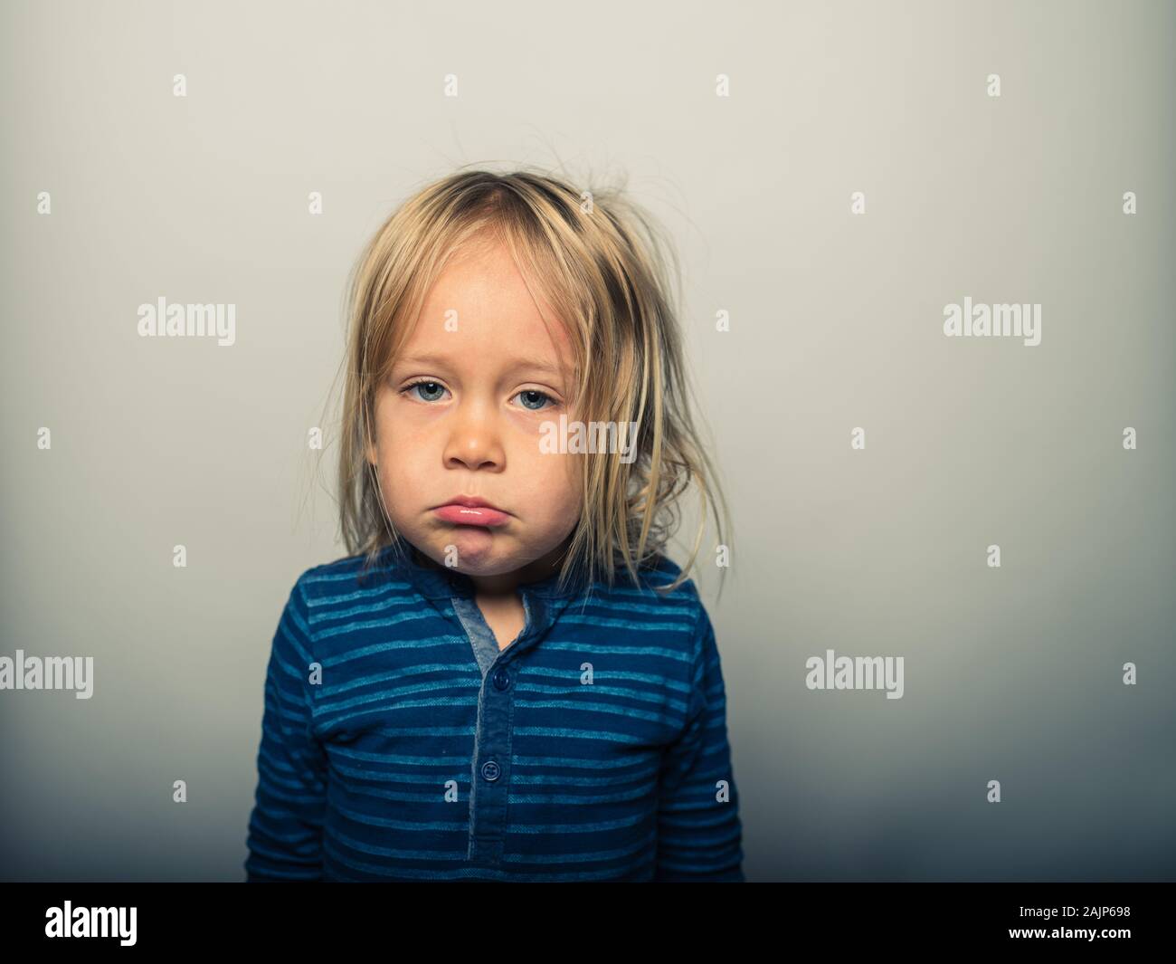 Studio portrait of a toddler doing sad faces Stock Photo - Alamy