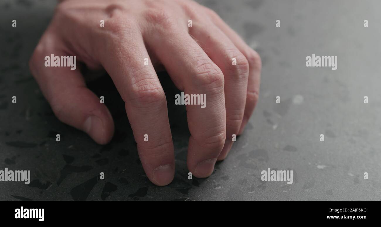 closeup man finger tapping on terrazzo countertop, wide photo Stock ...
