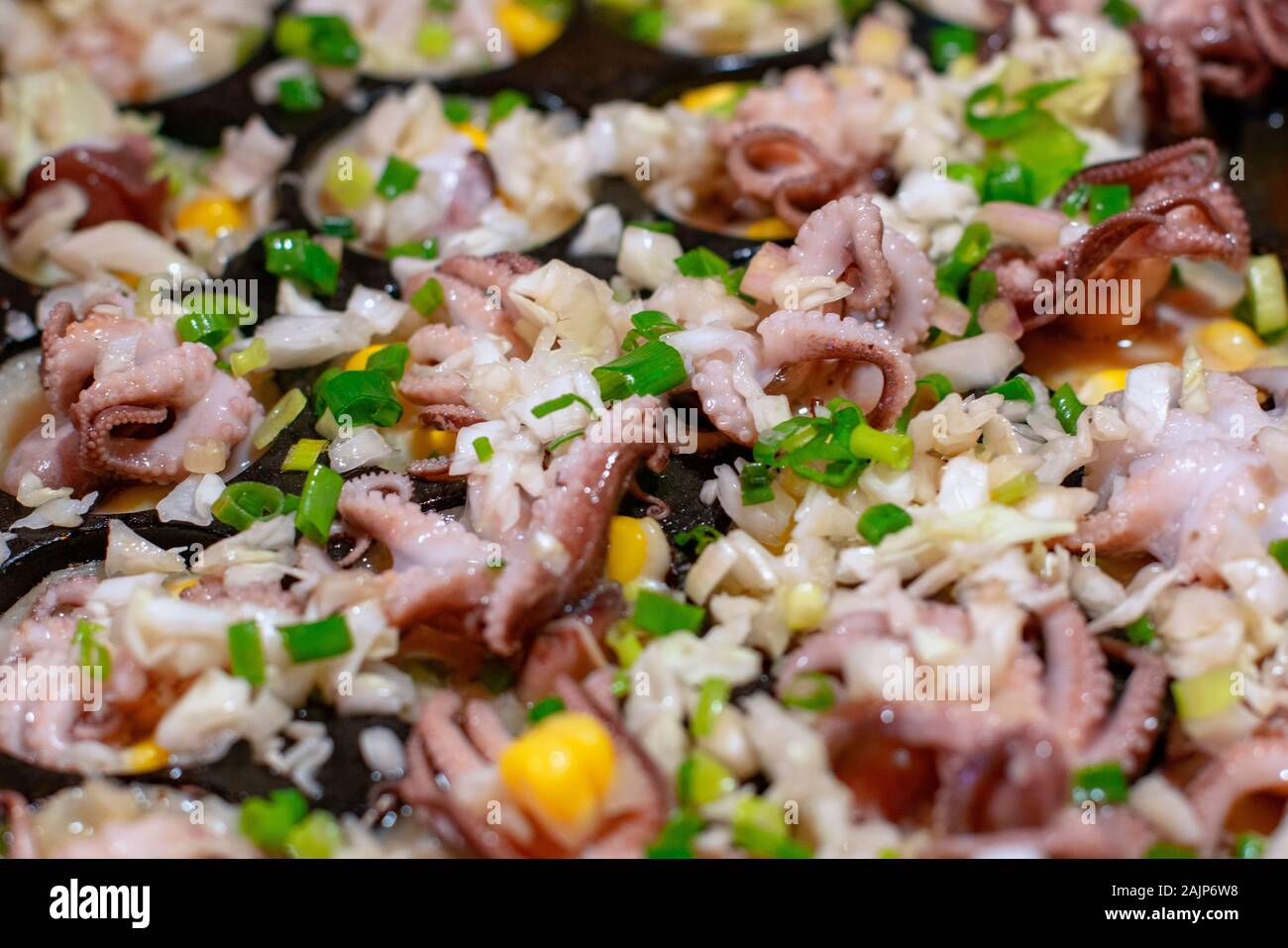 Small squids cooked Stock Photo - Alamy