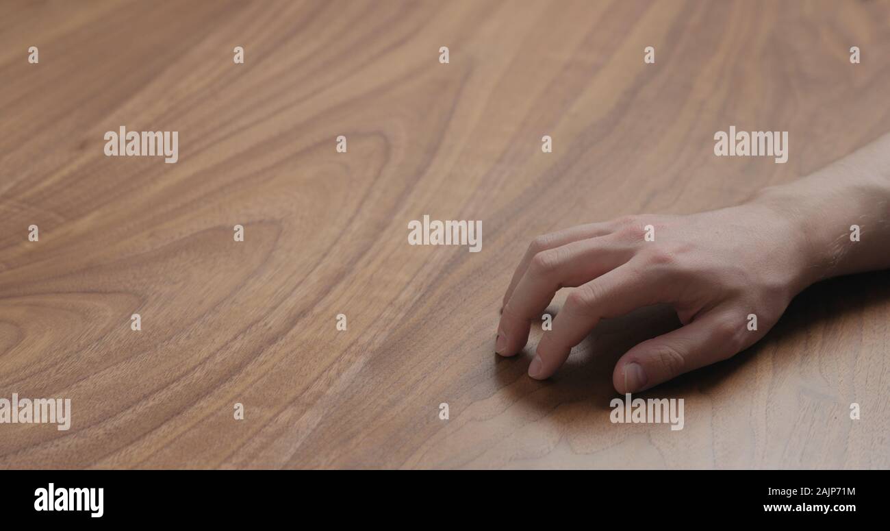 man hand finger tapping on black walnut table, wide photo Stock Photo ...