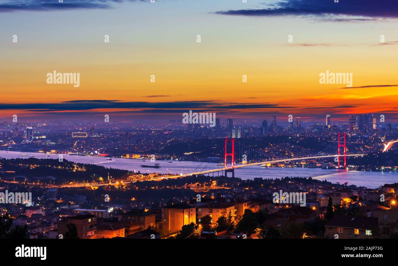 Sunset and illumination of the Bosphorus bridge and buildings of ...