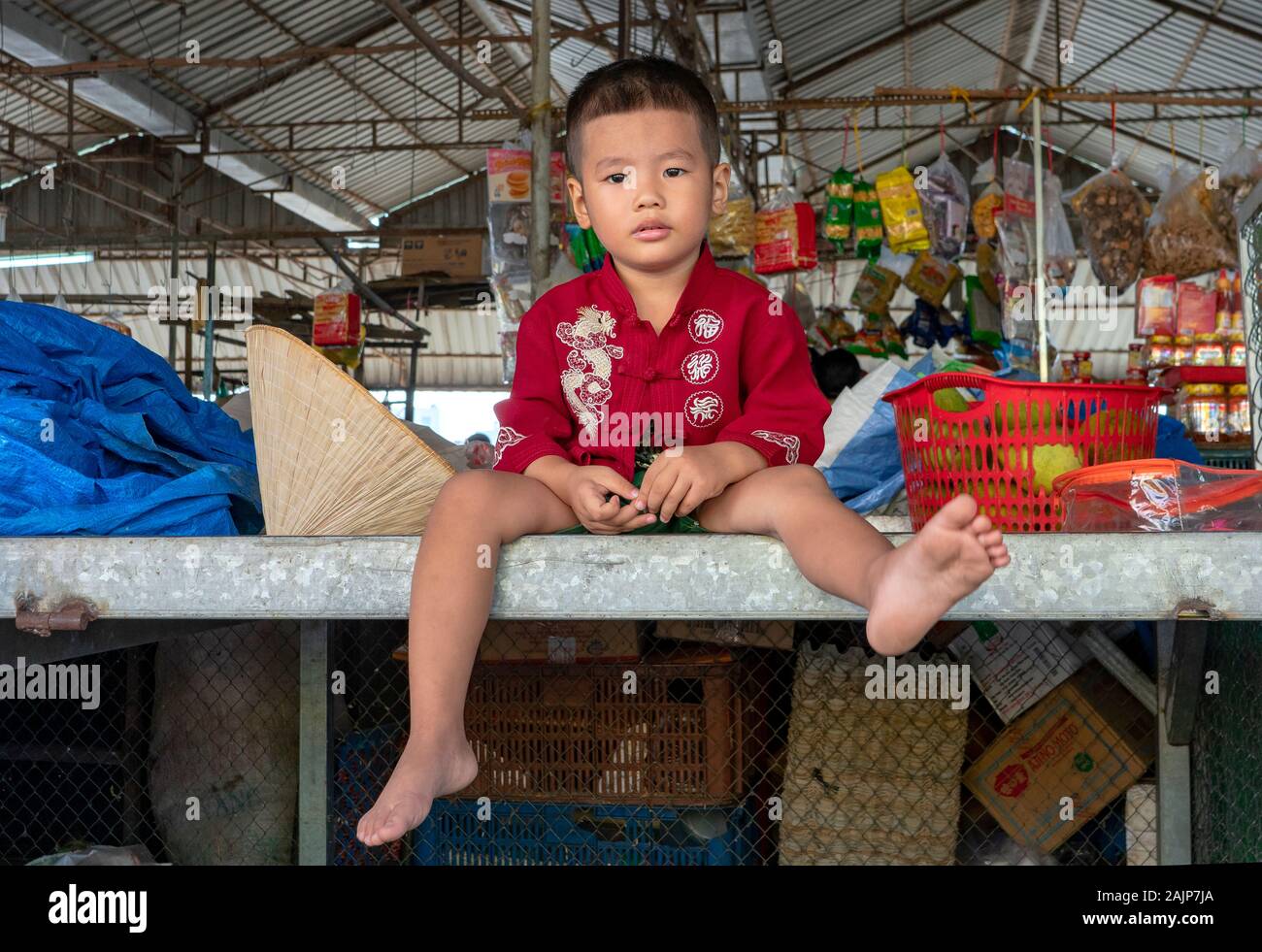 A child is sitting on a stand Stock Photo - Alamy