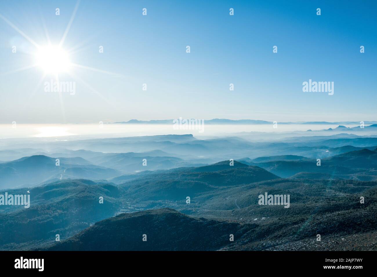 An aerial view of the forest and mountains with an open sky Stock Photo ...