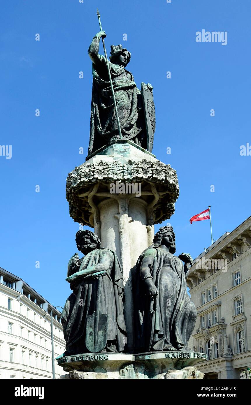 Austria, sculpture of Austria fountain and flag on Freyung square in ...