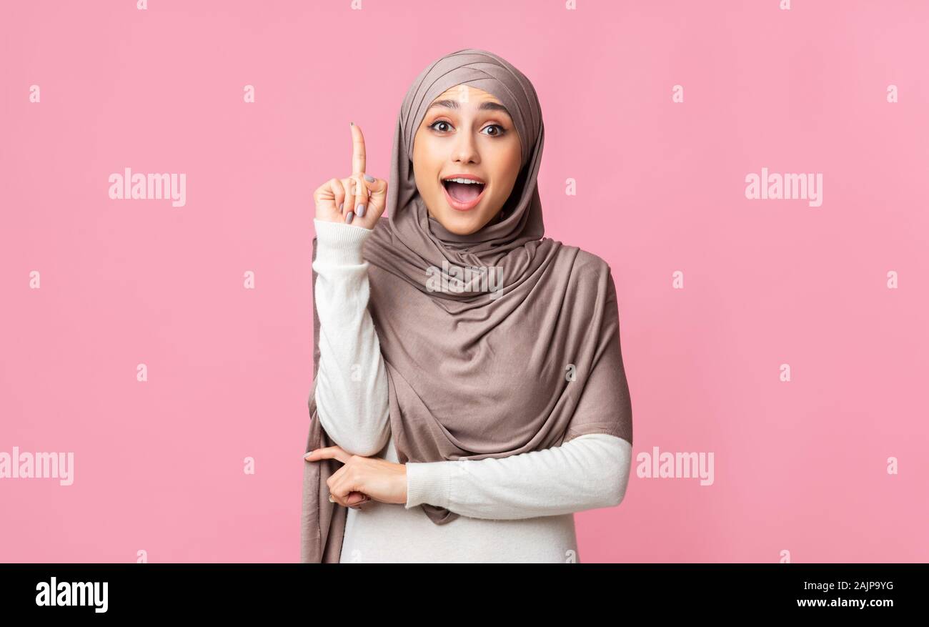 I Have Idea. Young Islamic Woman In Hijab Pointing Finger Up, Got ...