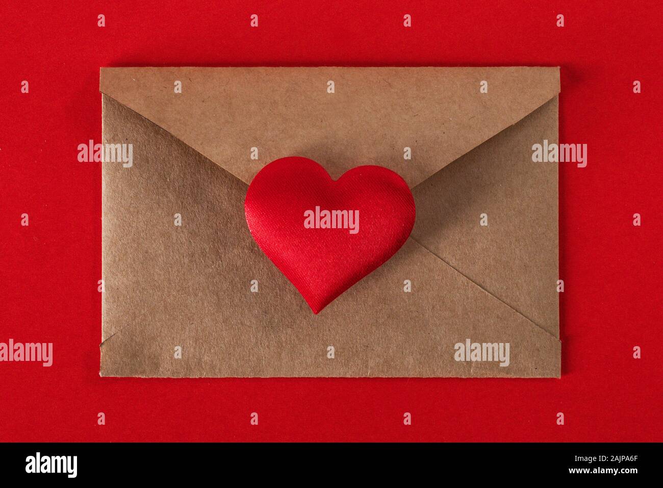Valentine day love letter, envelope of craft paper with red heart on ...