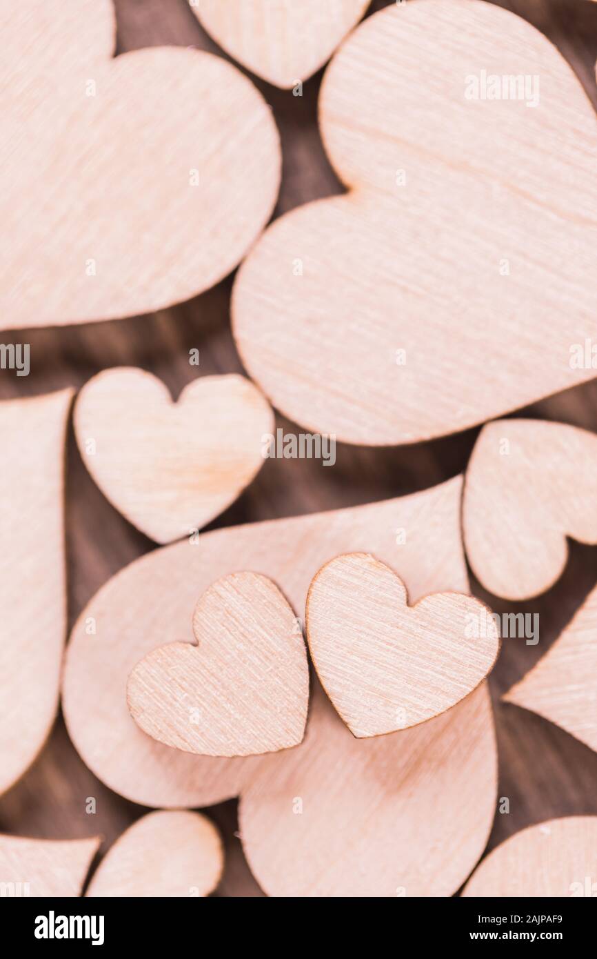 Many wooden colorless hearts background, two special ones true love ...