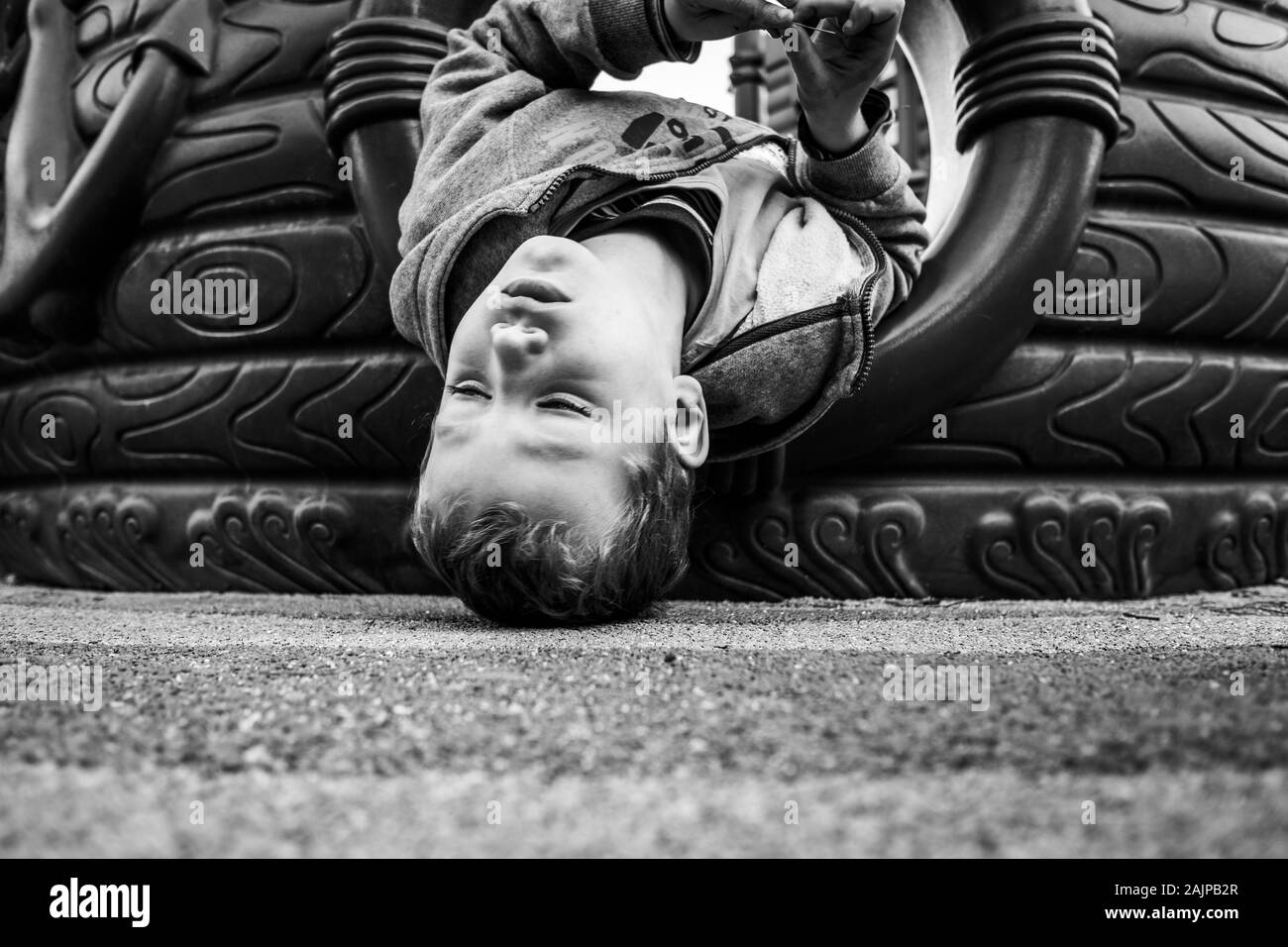 Playground alone boy lonely Black and White Stock Photos & Images - Alamy
