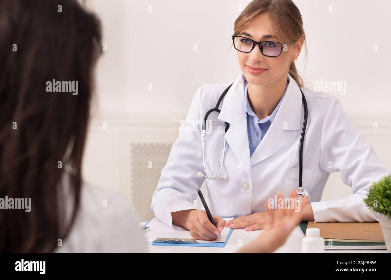 Doctor's Appointment. Woman Visiting Female Physician Sitting In Modern ...
