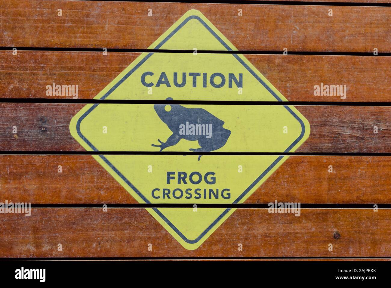 Caution sign, frogs crossing, in a zoo Stock Photo - Alamy