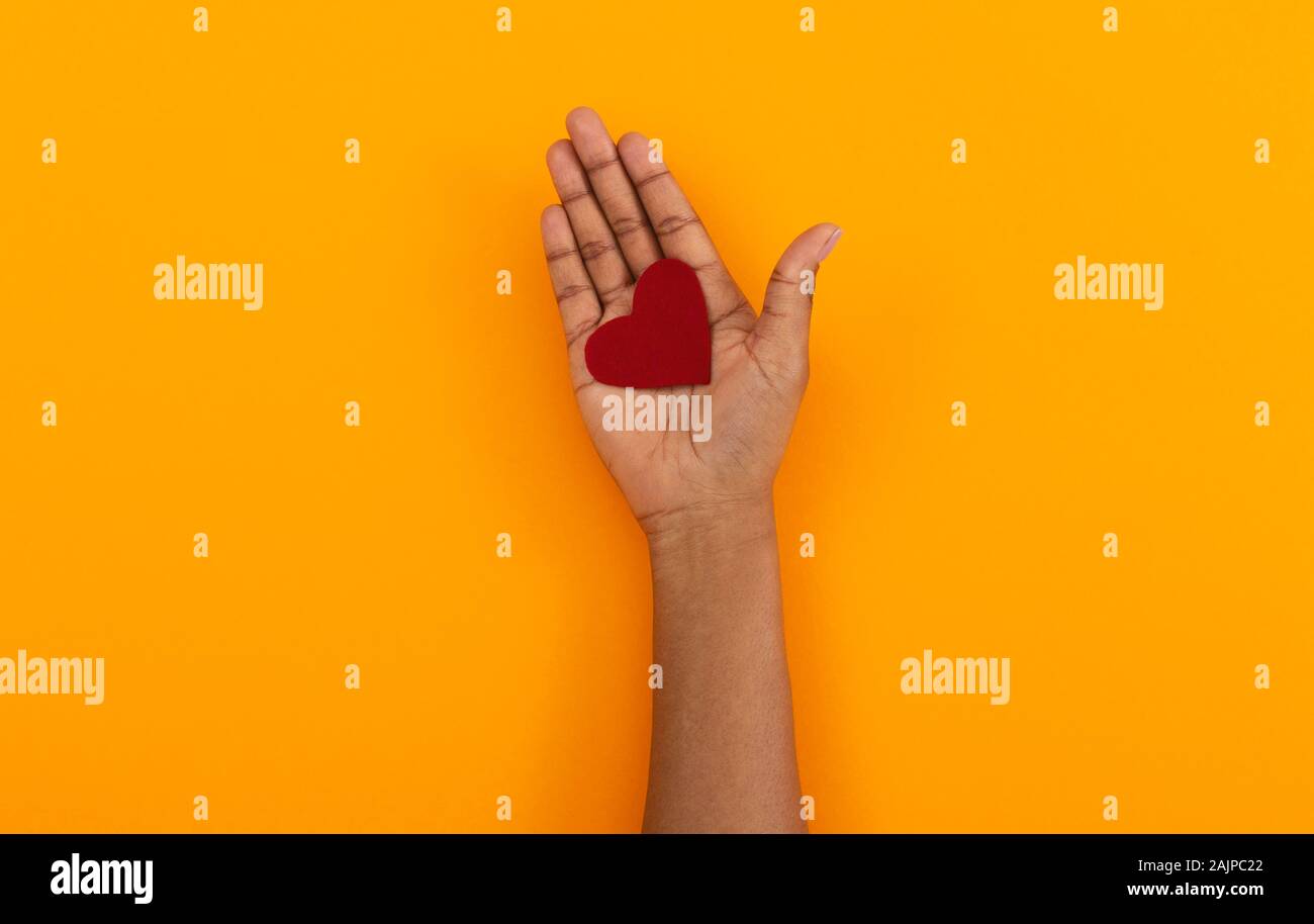 Black woman hand over heart hi-res stock photography and images - Alamy
