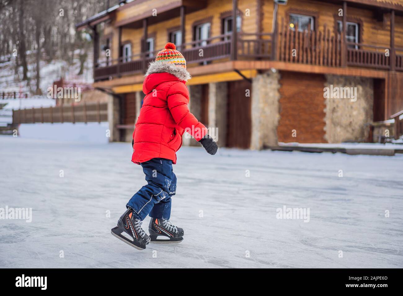 Boy ice skating for the first time Stock Photo - Alamy