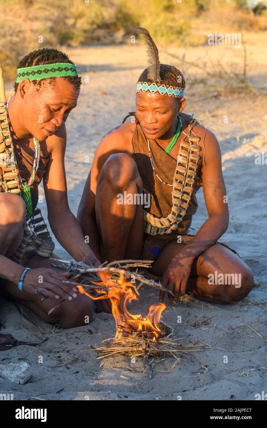 San Bushmen showing how to light a fire, Kalahari, Botswana Stock Photo ...