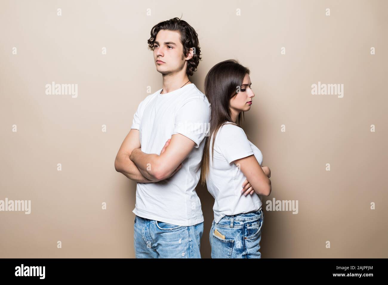 Offended guy and girl resenting and acting like arguing couple standing ...