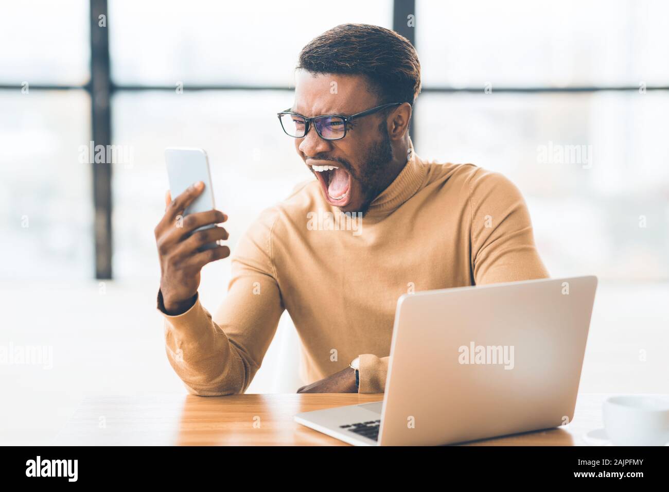 Angry man yelling at phone rage hi-res stock photography and images - Alamy