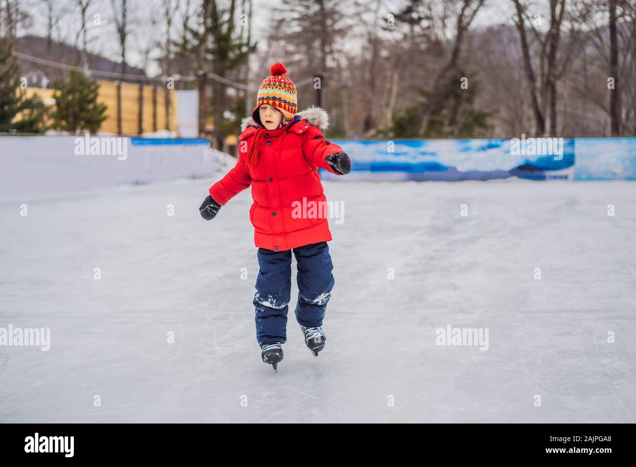 Boy ice skating for the first time Stock Photo - Alamy