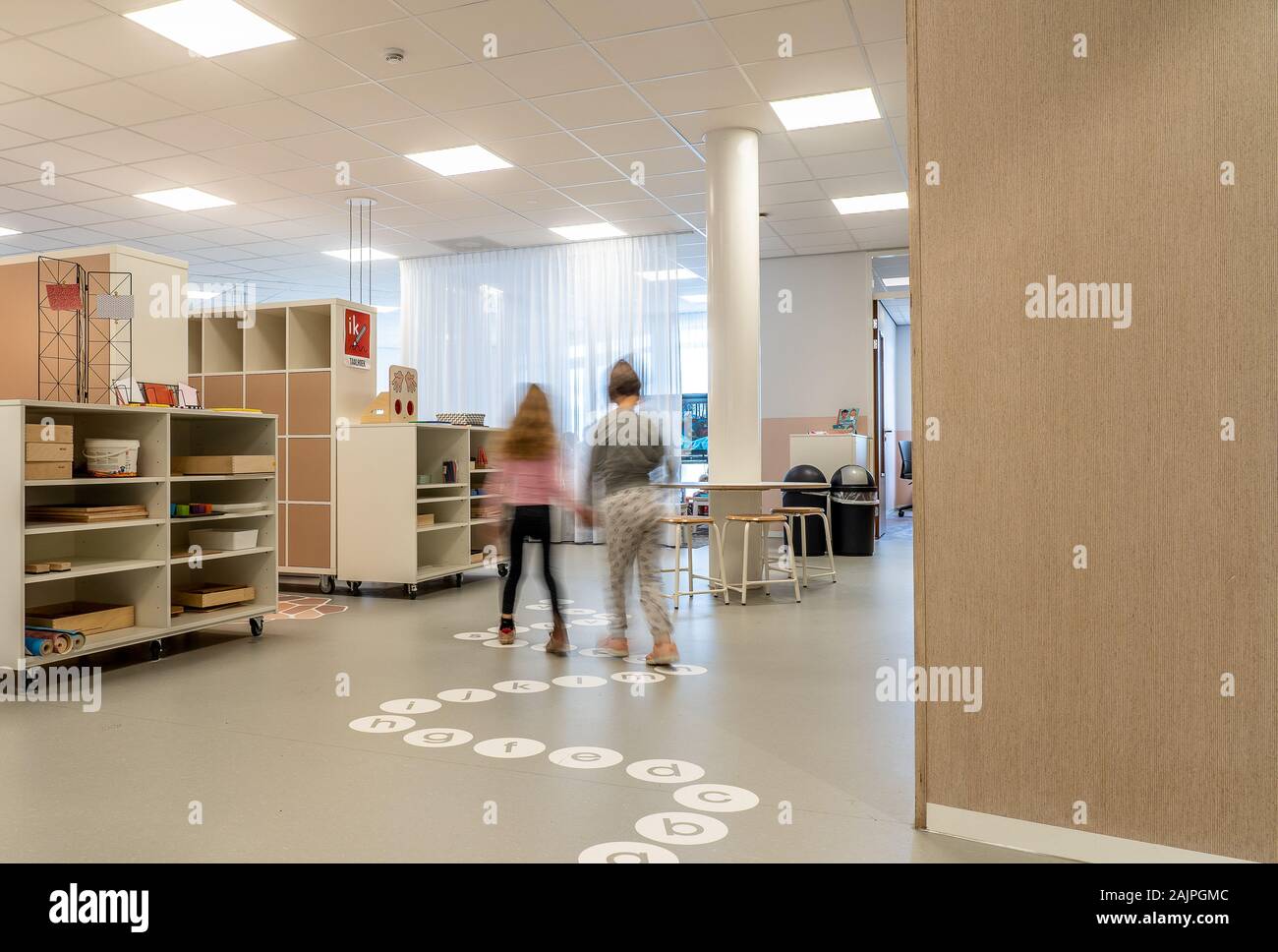 Boy in school hall hi-res stock photography and images - Alamy