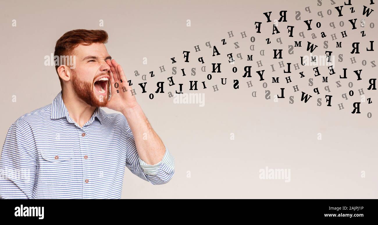 Shouting guy. Crazy emotional man screaming at copy space over grey ...