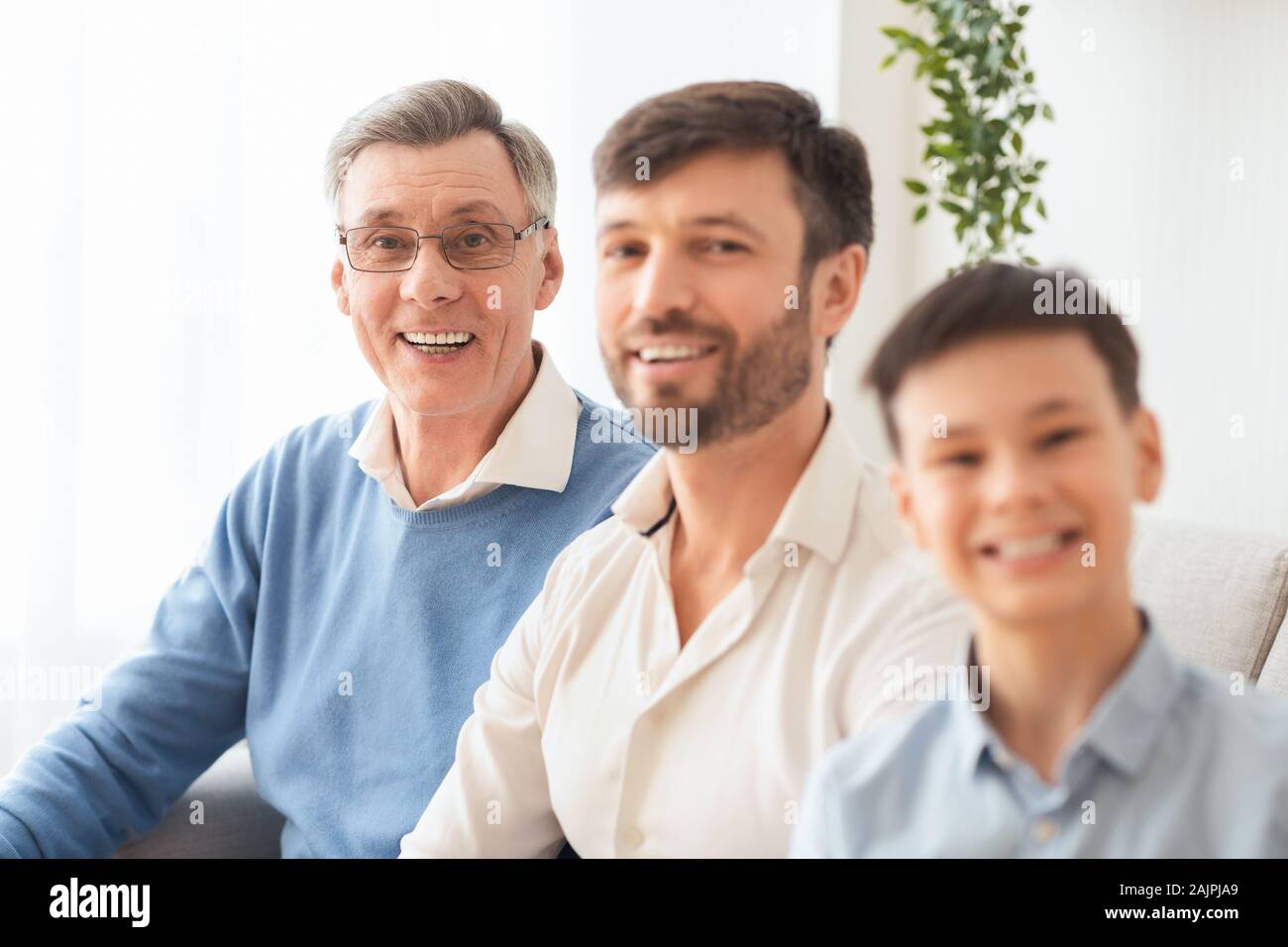 Multi-Generational Family. Joyful Senior Man, His Adult Son And ...