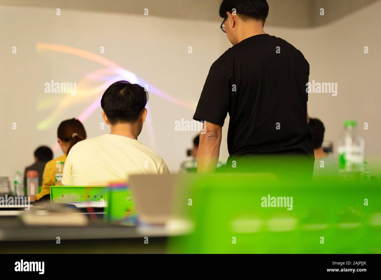 Teacher explaining a lesson to students hi-res stock photography and ...