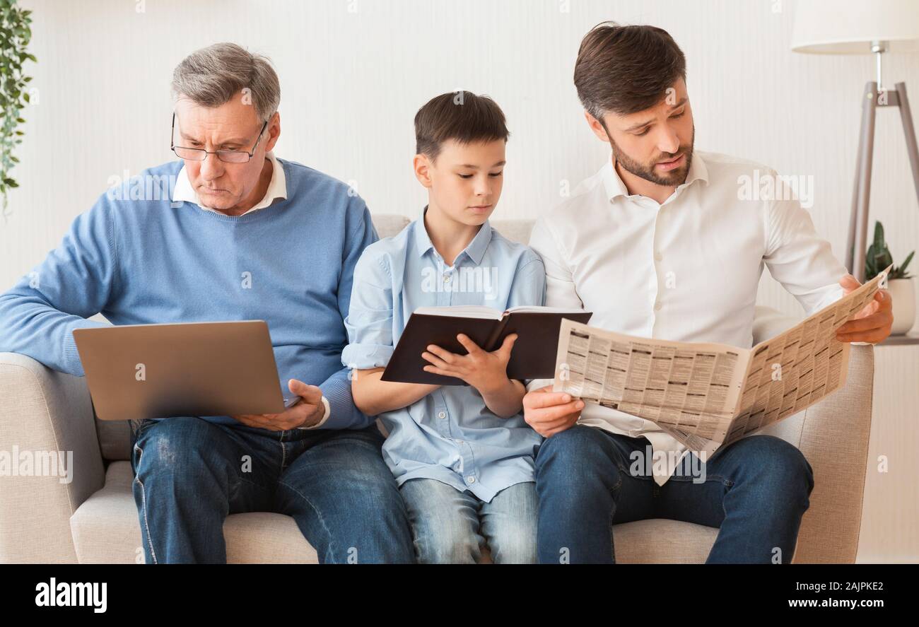 Grandfather, Father And Son Using Laptop, Reading Book And Newspaper ...