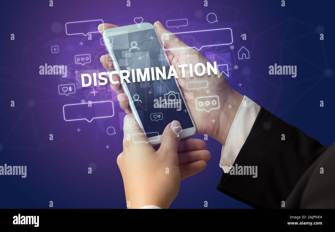 Female hand typing on smartphone with DISCRIMINATION inscription ...
