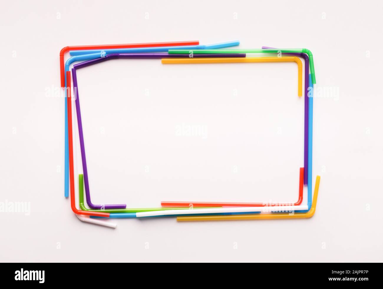 Colored frame of plastic straws with copy space inside for recycling ...