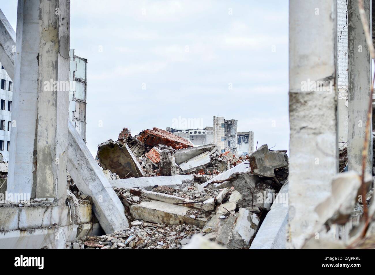 Remains of the destroyed industrial building. Large concrete piles ...