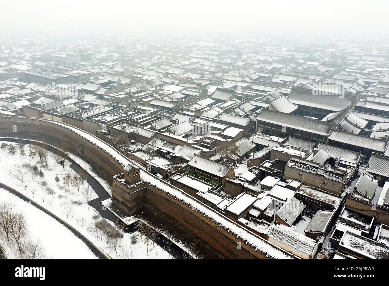 Pingyao, China. 5th Jan, 2020. Aerial photo taken on Jan. 5, 2020 shows ...