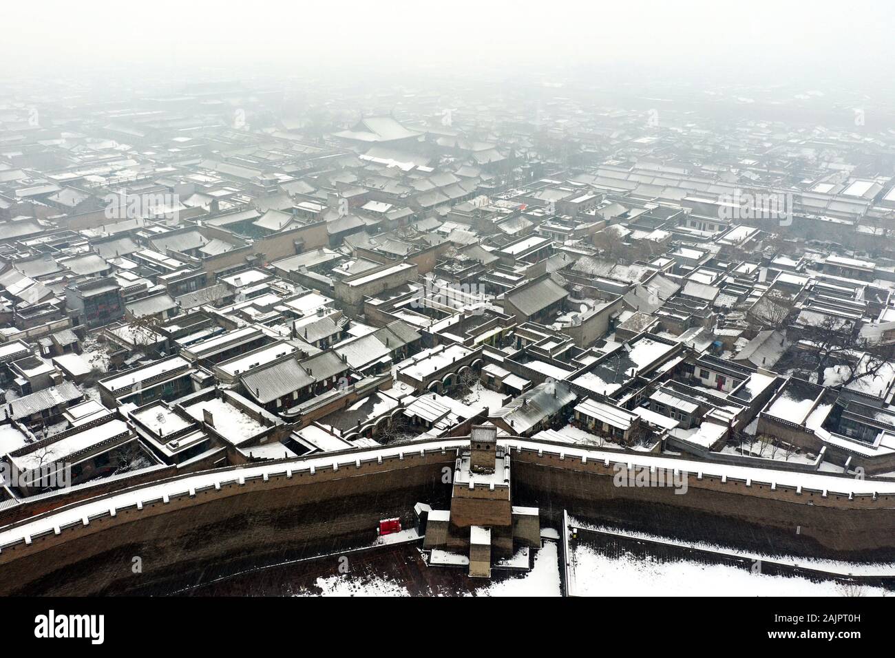 Pingyao, China. 5th Jan, 2020. Aerial photo taken on Jan. 5, 2020 shows ...