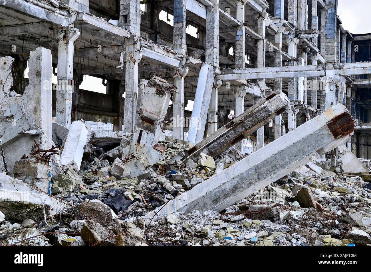 Remains of the destroyed industrial building. The skeleton of a large ...