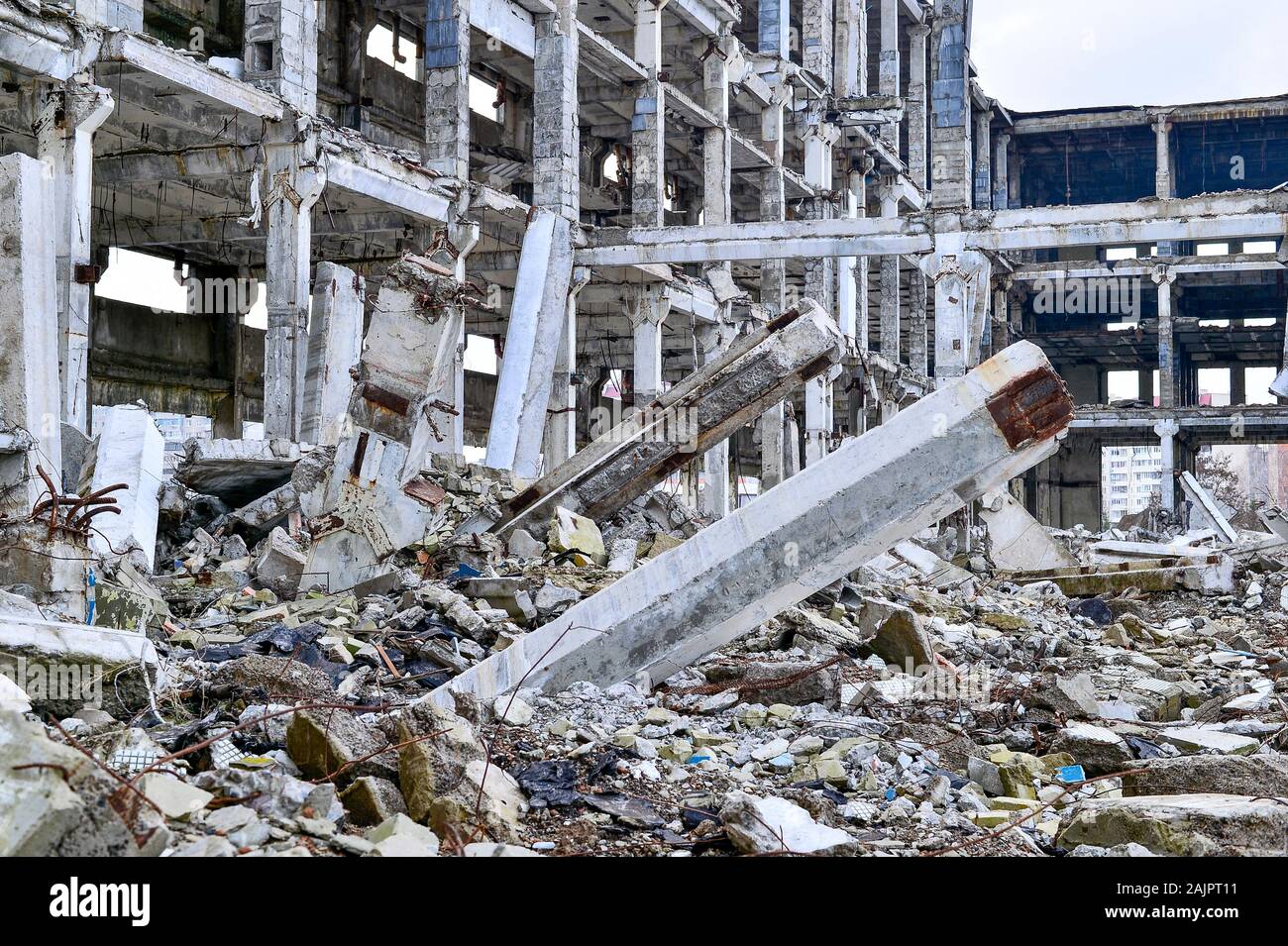 Remains of the destroyed industrial building. The skeleton of a large ...